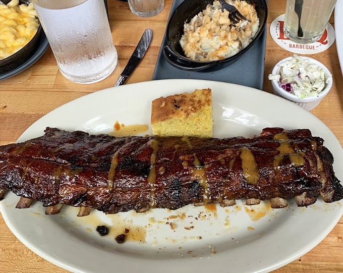 These ribs arrive glazed and glorious, ready to test the structural integrity of your jaw and your willpower.