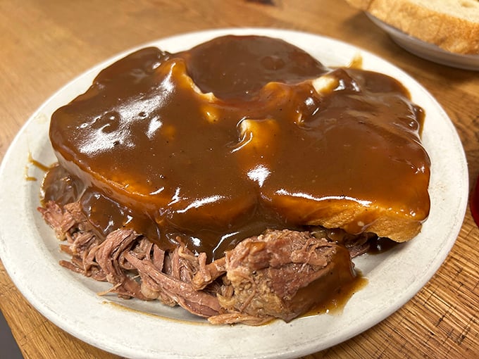 Roast beef swimming in gravy that could make a vegetarian question their life choices. This is comfort food with authority.