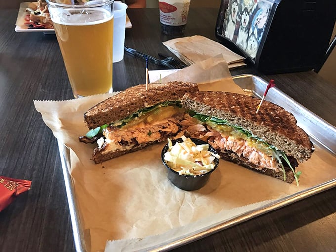 The salmon BLT arrives like a delicious puzzle—how to fit all that goodness into one bite without wearing half of it home.