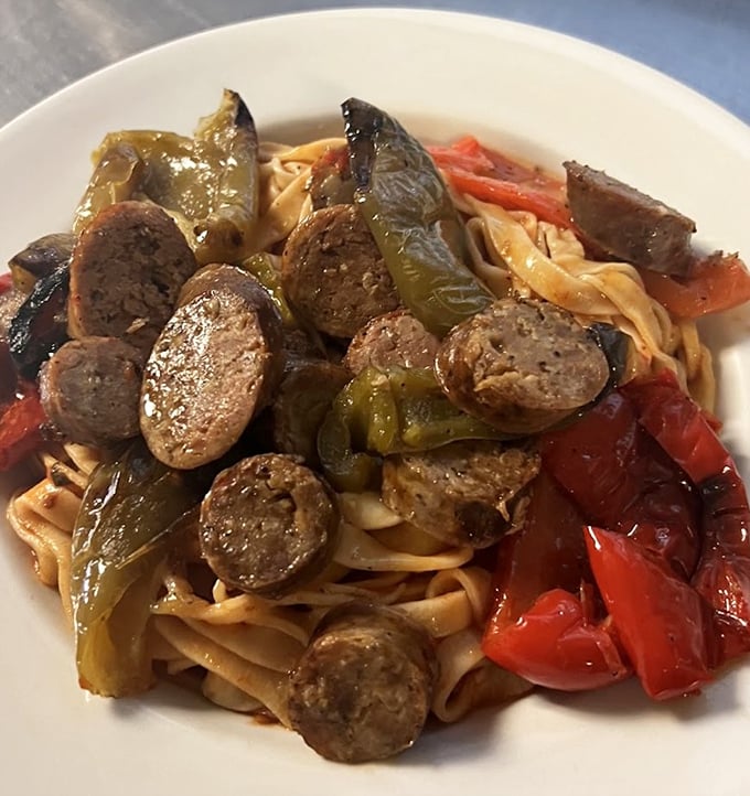 Pasta with sausage and peppers – where fennel-flecked meat and sweet peppers find their soulmate in perfectly cooked noodles.