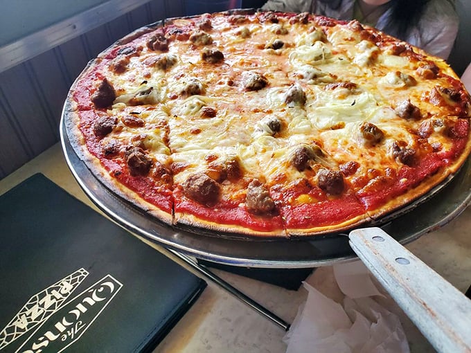 Sausage pizza that would make Tony Soprano nod with approval. Those little flavor bombs aren't just toppings—they're the reason stretchy pants were invented.