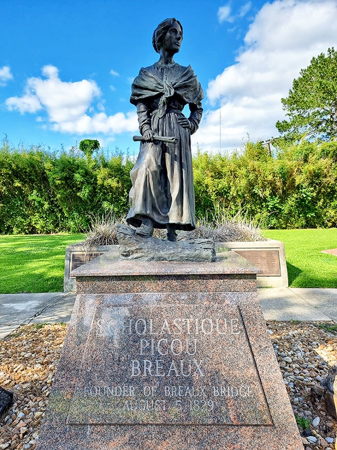 Scholastique Picou Breaux stands eternally in bronze, probably wondering why everyone's walking around staring at little rectangles of light all day.