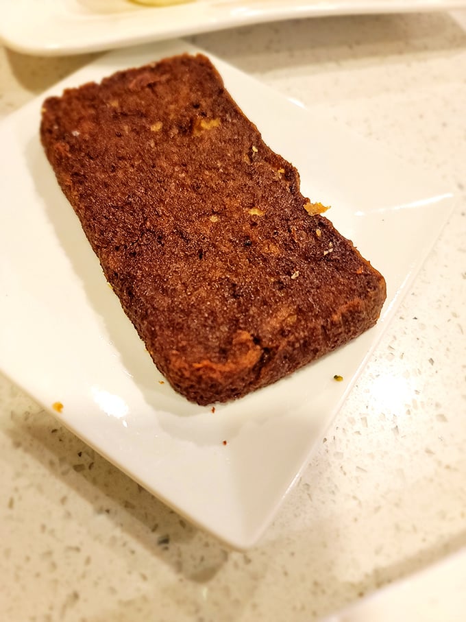 This scrapple—Delaware's breakfast of champions—offers that perfect crispy exterior hiding a savory interior that locals swear by.