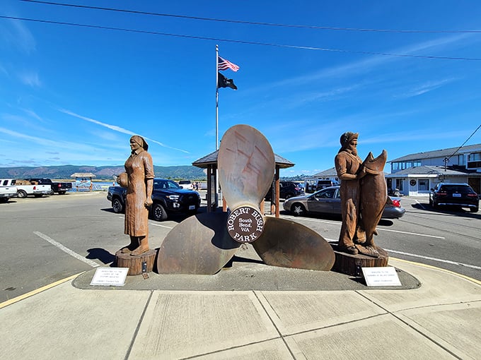 Carved wooden figures flank the giant oyster, creating a trio of monuments that celebrate South Bend's maritime soul.