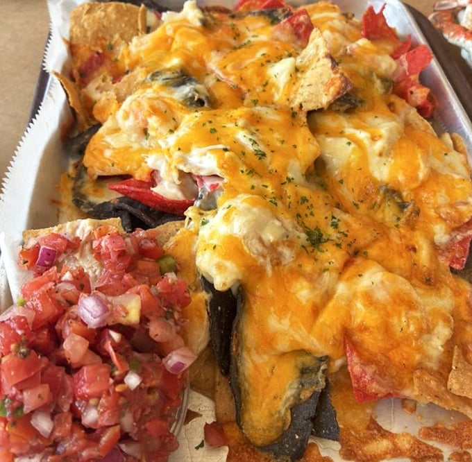 Cheese pulls for days in this seafood nacho masterpiece, where crab meat gets the royal treatment it deserves, complete with fresh salsa sidekick.