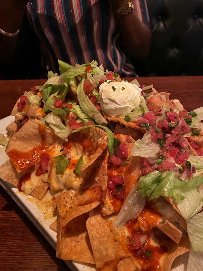 Seafood nachos that defy gravity and expectations. This towering masterpiece of chips, cheese, and fresh seafood makes sharing nearly impossible—you've been warned.