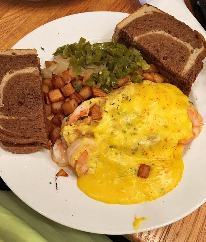 This seafood omelet doesn't whisper "good morning"—it belts it out with plump shrimp and a melody of perfectly melted cheese.