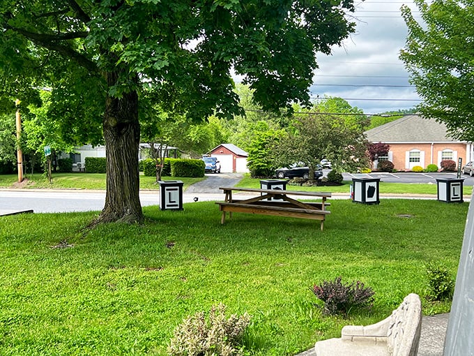 A peaceful picnic area surrounds the landmark, where visitors can enjoy their own brews while contemplating the delightful absurdity of giant kitchenware architecture.