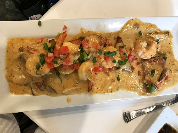 Shrimp and grits get the royal treatment here, with plump crustaceans lounging in a sauce so good you'll be plotting ways to take it home.