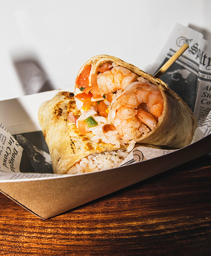 Plump shrimp nestled in a grilled tortilla with fresh veggies—this burrito means serious business in the best possible way.