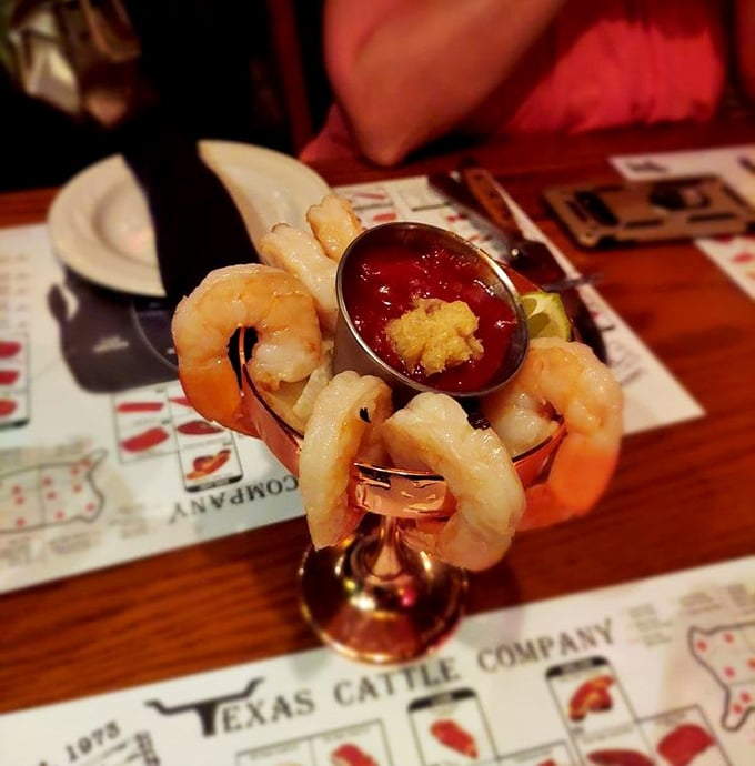 The shrimp cocktail arrives like celebrities at a red carpet event – plump, perfectly poised, and ready for their close-up with that spicy cocktail sauce.