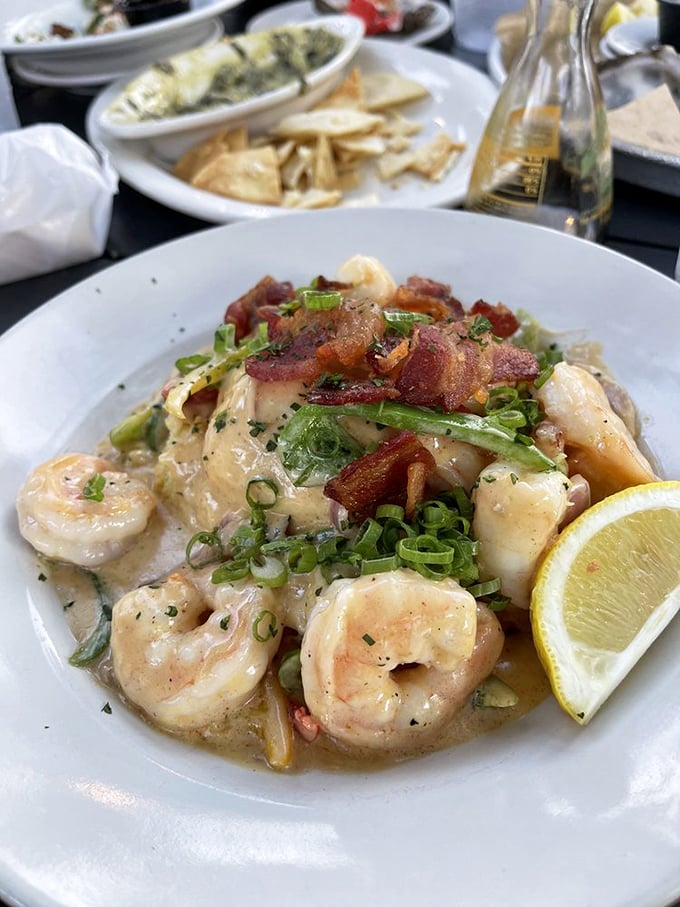 Plump shrimp lounging in a creamy sauce with crispy bacon and fresh herbs. Southern comfort food that's dressed for a night on the town.