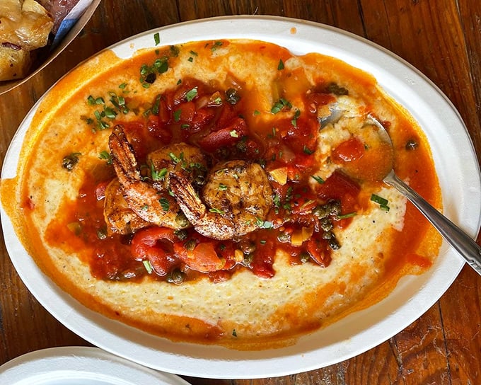 Shrimp and grits get the Chicago treatment – bold, unapologetic, and ready to impress. That orange-red sauce isn't playing around.
