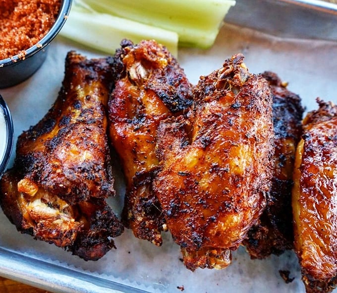 These wings have clearly been introduced to smoke and spice in the most intimate way possible. Finger-licking isn't just encouraged—it's inevitable.