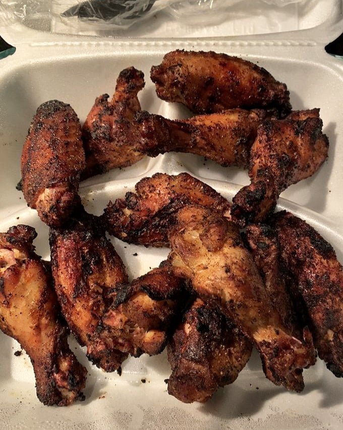These wings aren't trying to fly—they've found their higher purpose as vehicles for smoke and spice.