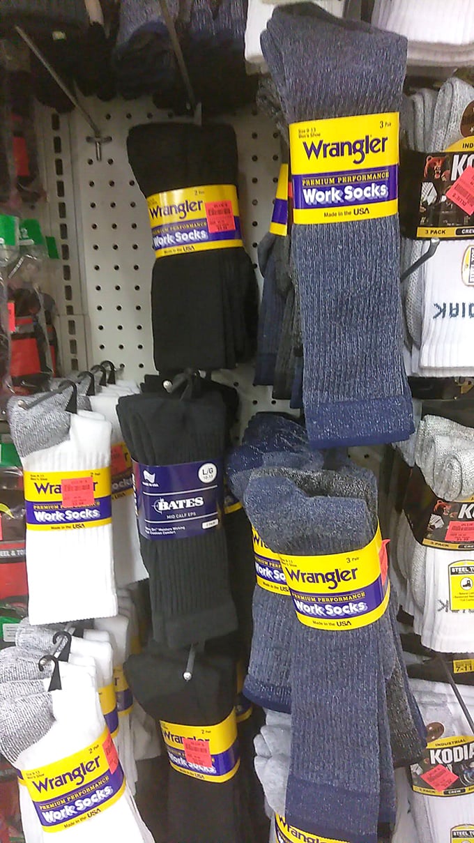 The sock aisle – where Wrangler work socks hang like textile trophies, proving even practical purchases can feel like victories at these prices.