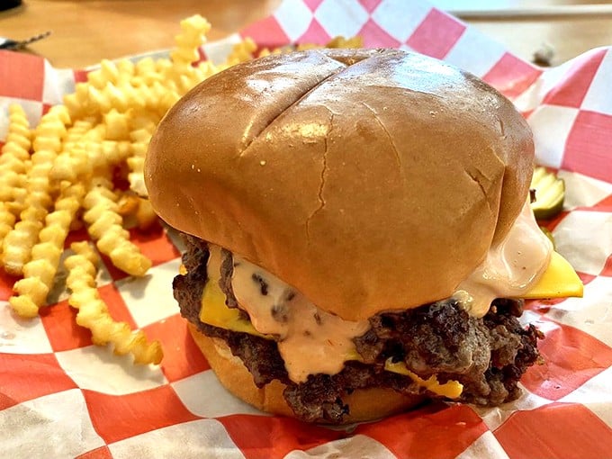 This isn't just a burger—it's a masterclass in proper cheese-to-beef ratio, nestled in a bun that's somehow both substantial and cloud-like.