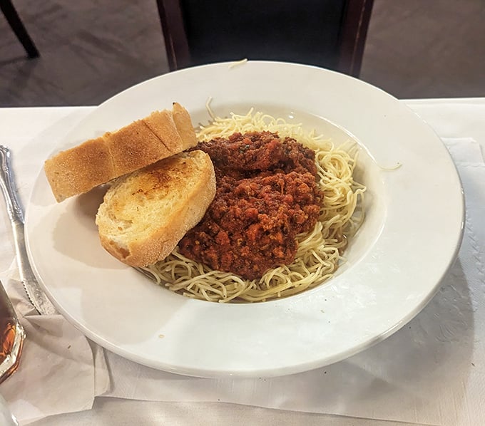 Spaghetti with meat sauce and garlic bread—proof that comfort food doesn't need a fancy pedigree to make you feel like royalty.