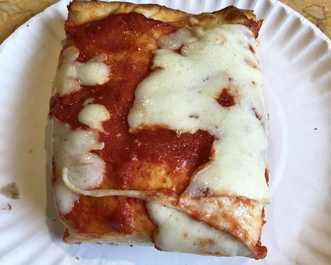 The Sicilian slice – a rectangle of perfection that makes geometry delicious. That crust could solve world peace.
