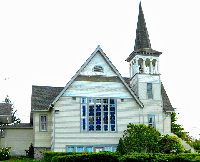 St. Mary's Church stands like a bright beacon against Washington's famous blue-gray skies, its steeple pointing toward heaven as if to say, "This way to serenity."