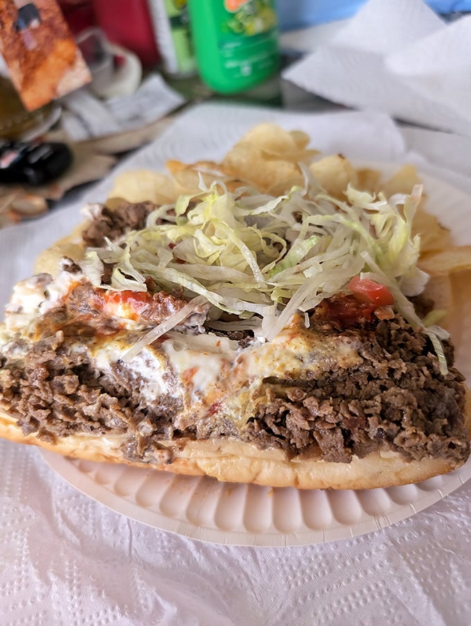 Meat, peppers, and cheese performing a culinary ballet on bread – the kind of sandwich that ruins all other lunches forever.