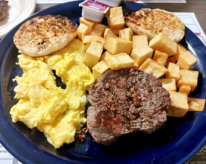Scrambled eggs, home fries, and what appears to be pon haus on a bagel—breakfast doesn't get more authentically regional.