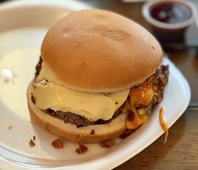 Melted cheese cascading over a perfectly cooked patty—this burger doesn't just speak to you, it serenades your soul with a ballad of bacon and beef.