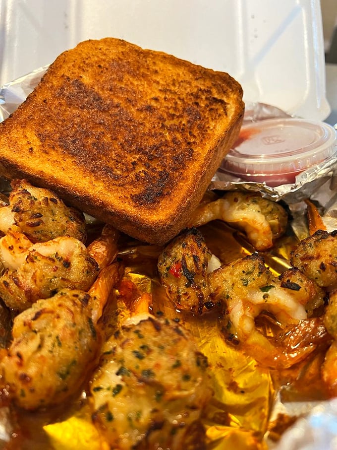 These aren't just shrimp – they're little flavor bombs disguised as seafood, served alongside golden garlic toast that's begging to soak up every last drop.