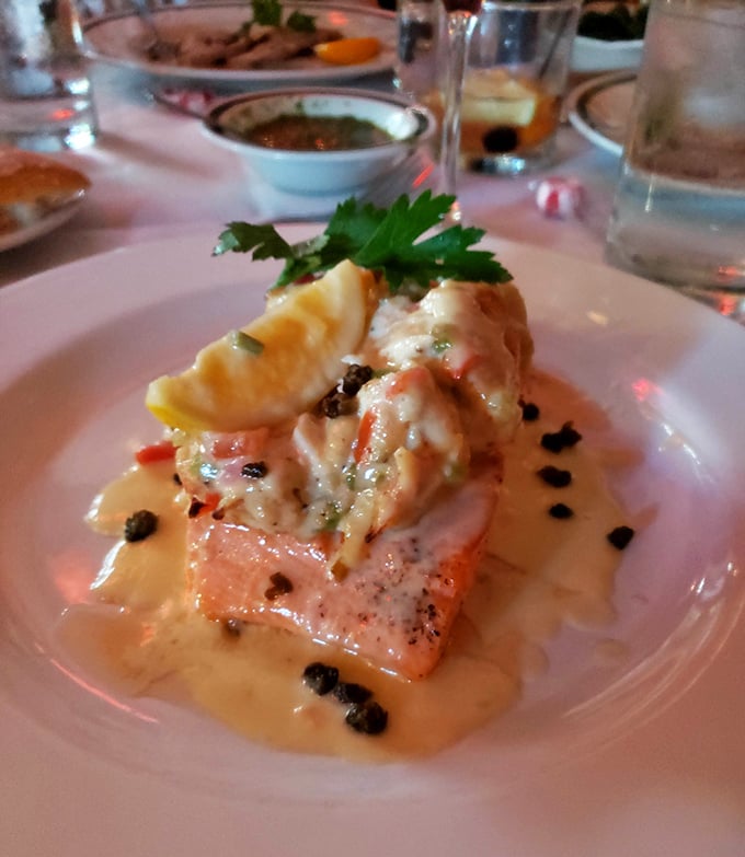 Salmon that's dressed better than most people at the Oscars, adorned with seafood and bathed in a sauce worth bottling.