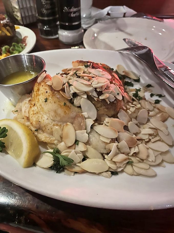 Seafood royalty: fish crowned with crab meat and toasted almonds—the kind of dish that makes you want to bow slightly before taking a bite.