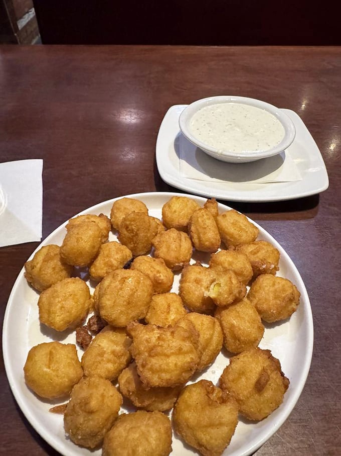Golden-fried sweet corn nuggets with creamy dipping sauce—proof that sometimes the best supporting actors steal the show from the main course.