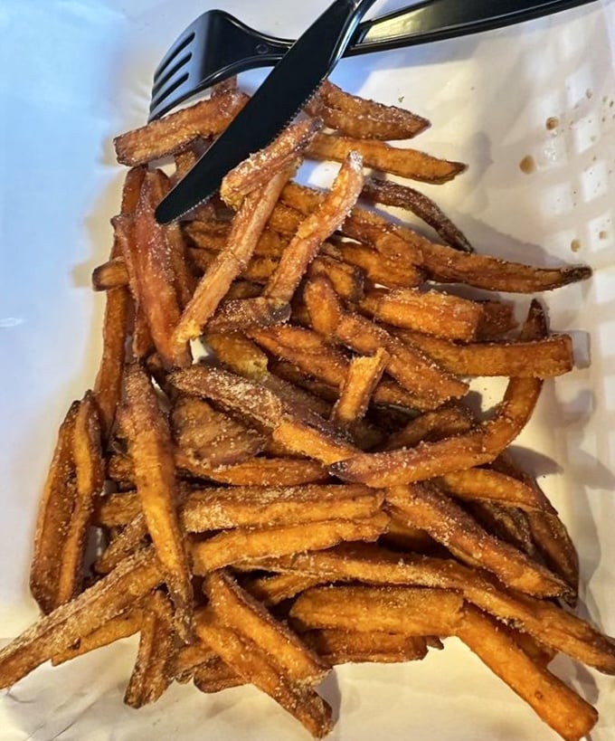 Sweet potato fries that strike the perfect balance between crispy exterior and tender interior—the supporting actor that steals the scene.