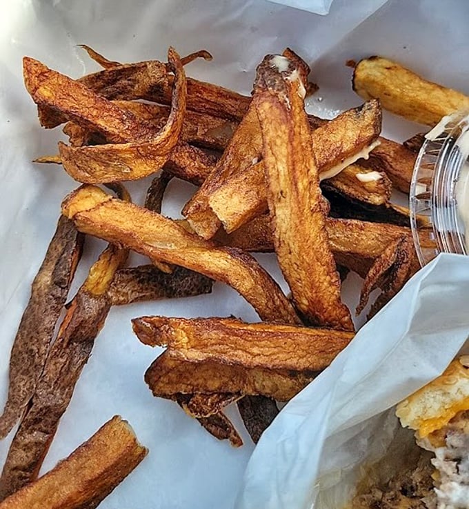 Hand-cut fries with personality—crispy edges, fluffy centers, and just enough seasoning to make you wonder why you ever ate frozen ones.