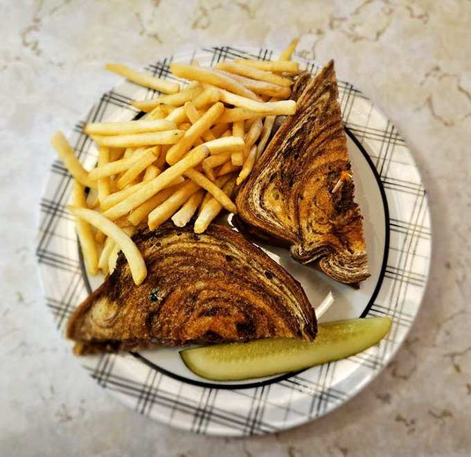 The perfect diner patty melt – where marbled rye, melted cheese, and beef unite in a harmonious trinity that makes you forget salads exist.