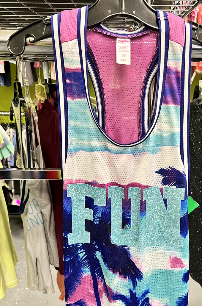 That "FUN" tank top says everything about thrift shopping philosophy. One person's abandoned vacation wear becomes another's summer statement piece.