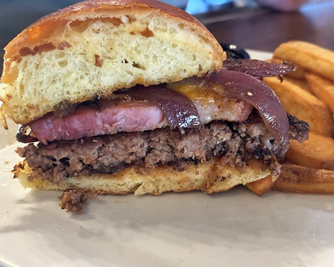 The Slab Burger doesn't just satisfy hunger—it conquers it. That cross-section reveals the perfect medium-rare pink that burger dreams are made of.