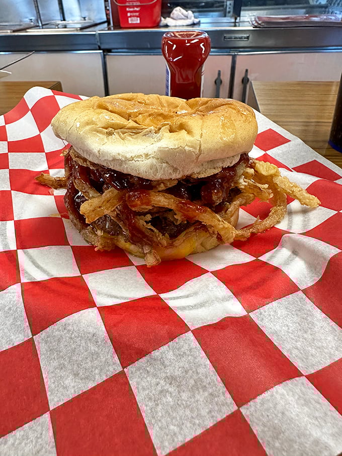 The Theta Burger with its crown of crispy onion strings—like a burger that graduated with honors and is showing off its achievement with delicious flair.