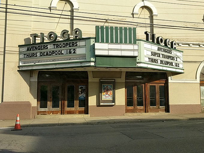 The Tioga Theater marquee promises entertainment the old-fashioned way—no streaming required, just community and classic movie magic.