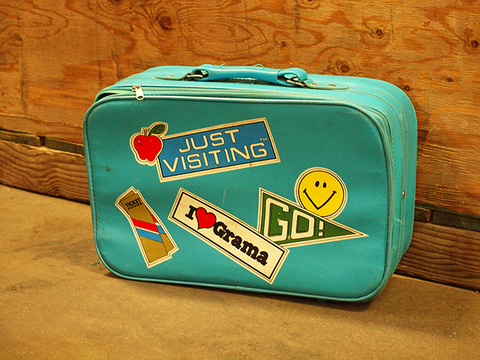 This vintage turquoise suitcase isn't just luggage – it's a time capsule with stories to tell and new adventures to join.