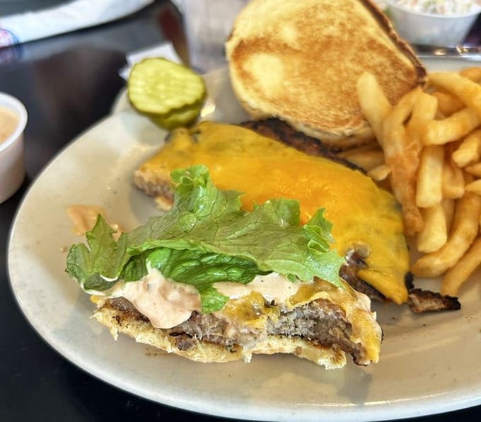 First bite magic!” Melted cheddar clings to the patty like an old friend, while crisp lettuce adds a refreshing crunch.