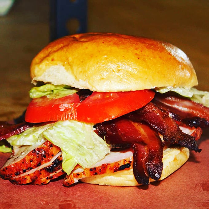This sandwich isn't just stacked—it's architected. Layers of smoky meat, fresh veggies, and a bun that knows its supporting role.