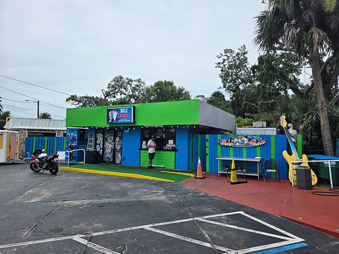 Uncle Chicken's vibrant facade pops against the Florida sky. The kind of local joint where calories don't count and napkins are absolutely necessary. 
