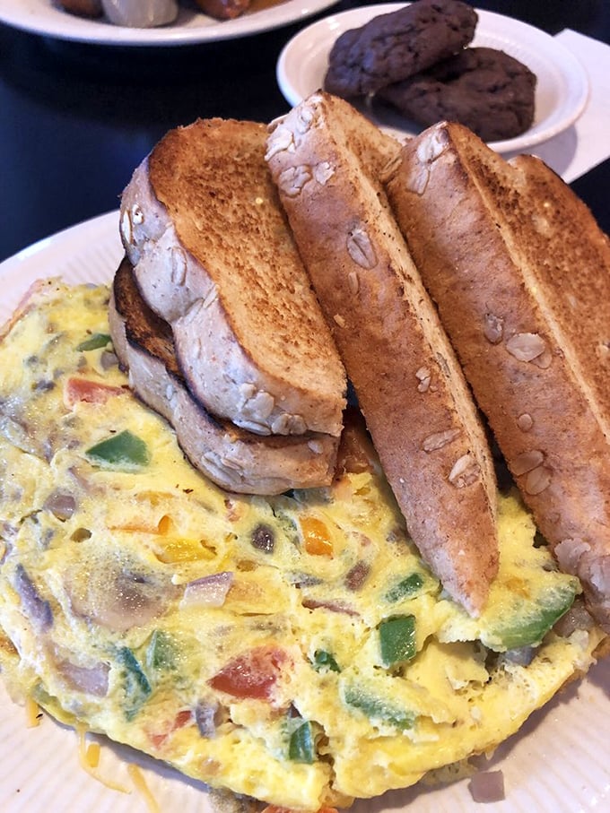 This veggie omelet packed with colorful peppers and served with hearty toast is what breakfast champions eat before conquering their day.
