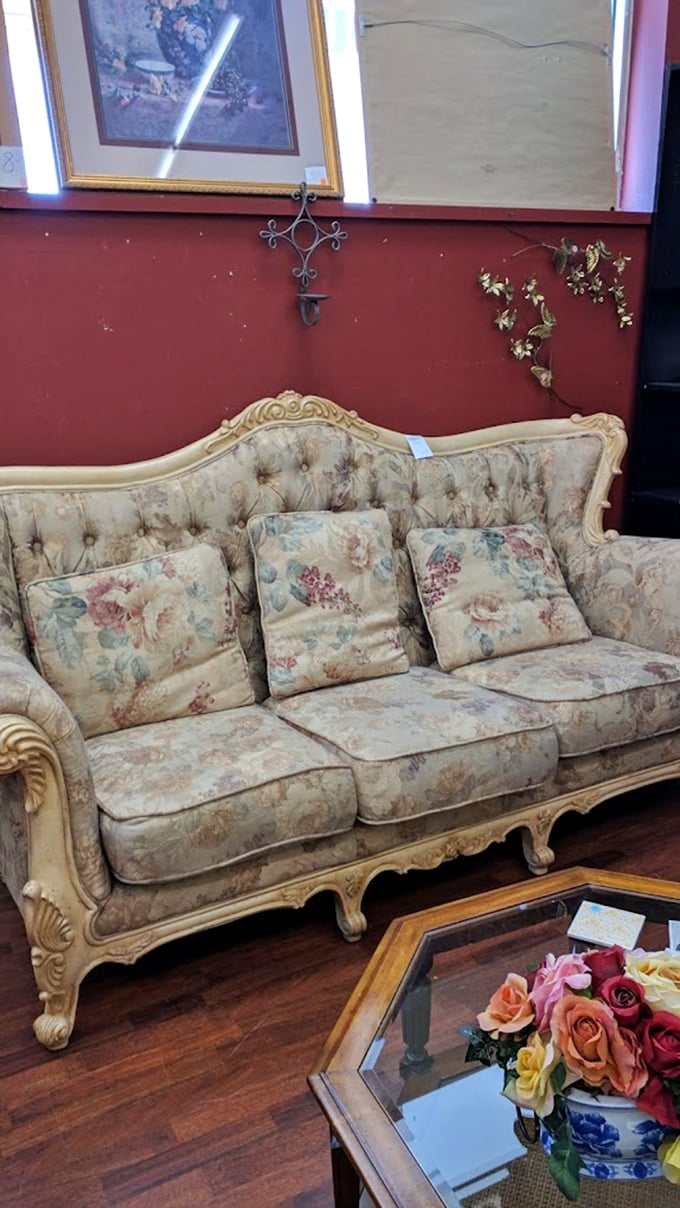 This vintage floral sofa isn't just furniture—it's a time machine to Grandma's living room, complete with the faint memory of plastic covers.