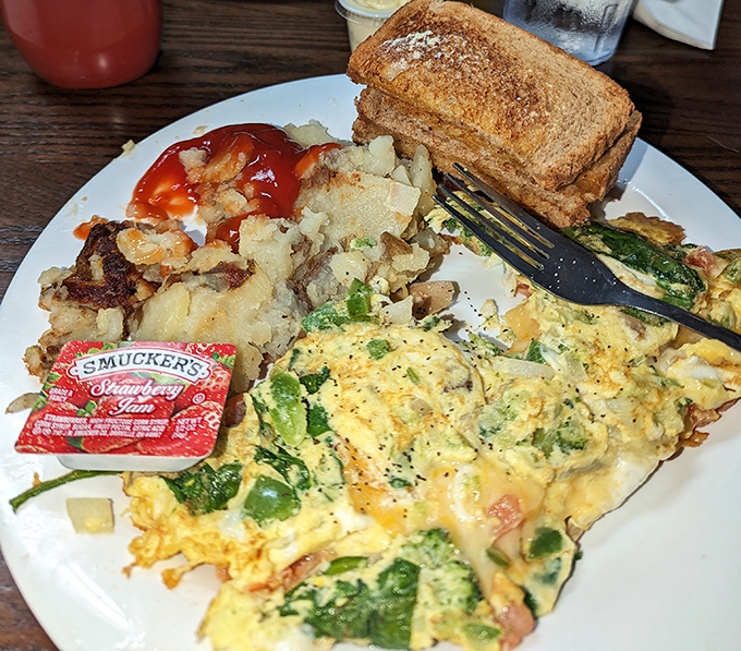 When vegetables sneak into breakfast and you're actually grateful – this omelet brings garden freshness to morning protein in perfect harmony.