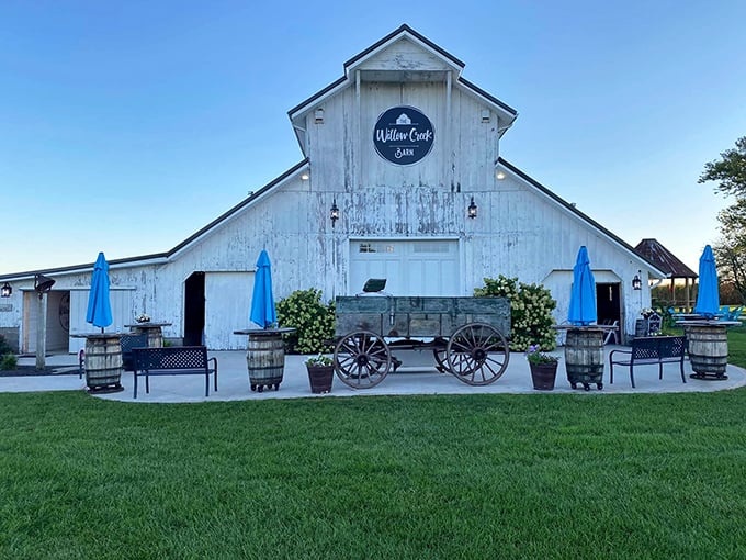 Willow Creek Barn transforms rural simplicity into Instagram-worthy charm. Those blue umbrellas aren't just for shade—they're invitations to sit awhile and forget about your portfolio.