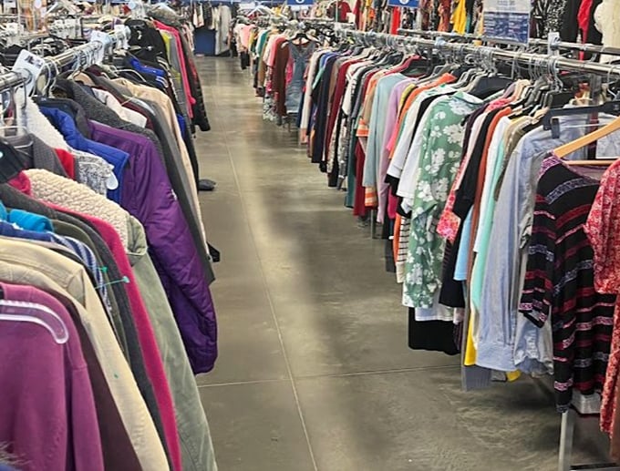 A textile rainbow stretches as far as the eye can see – each garment a character in search of its next chapter and closet.