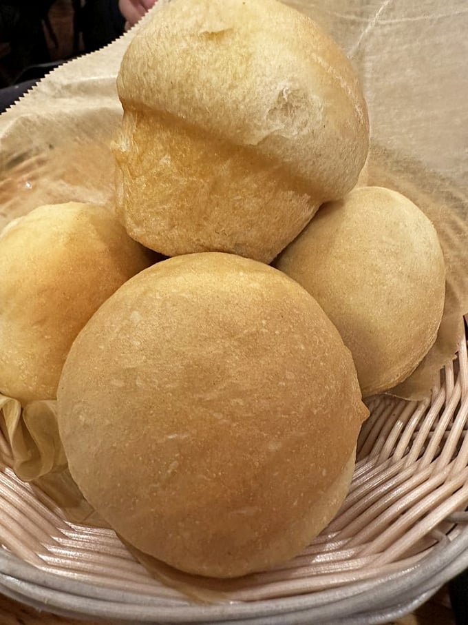 These pillowy yeast rolls aren't just bread—they're warm, fluffy clouds of carbohydrate heaven waiting to soak up every last drop of gravy.
