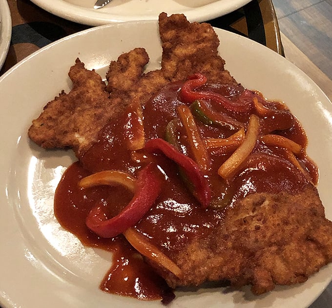 Zigeuner Schnitzel: where crispy breaded cutlets meet saucy bell peppers in a dance that would make your grandmother weep with joy.