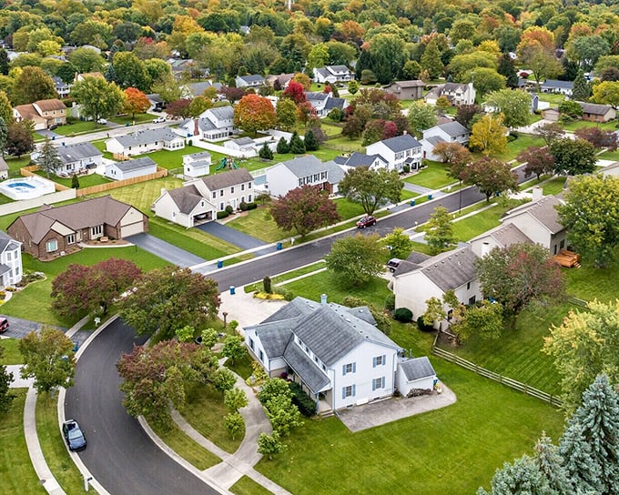 From above, Waterville reveals its perfect balance of residential neighborhoods, downtown charm, and nature's embrace along the riverfront.